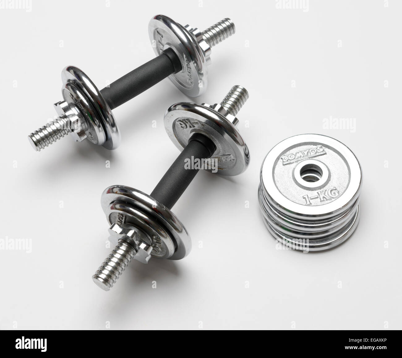 Dumbells and weight plates cut out isolated on white background Stock ...