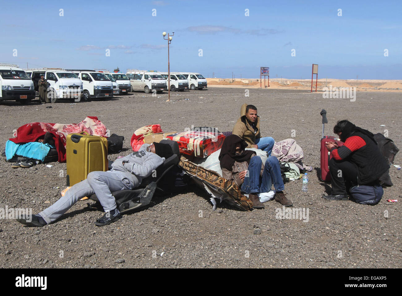 Salloum, Egypt. 21st Feb, 2015. Egyptian men wait to board buses back ...