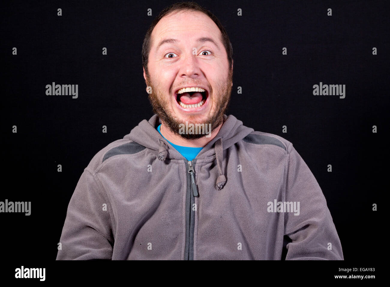 man laughing out loud isolated on black Stock Photo - Alamy