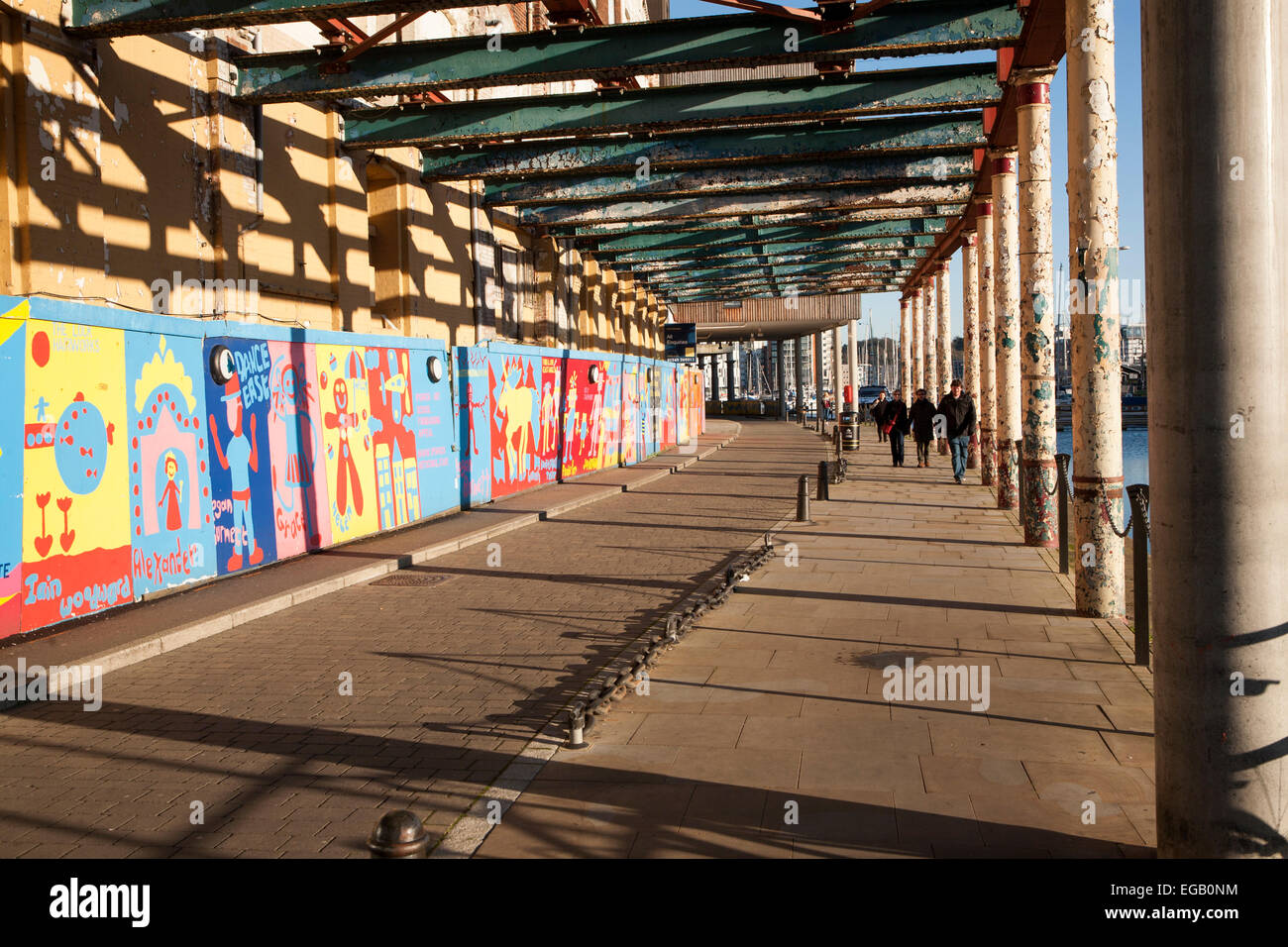Art boards painted by children outside derelict factory building in the ...