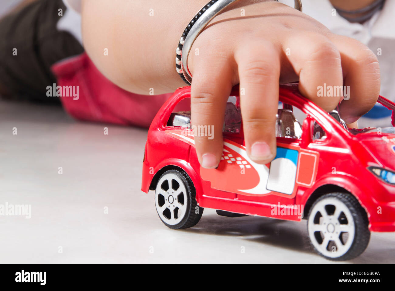 Indian boy playing with cars hi-res stock photography and images - Alamy