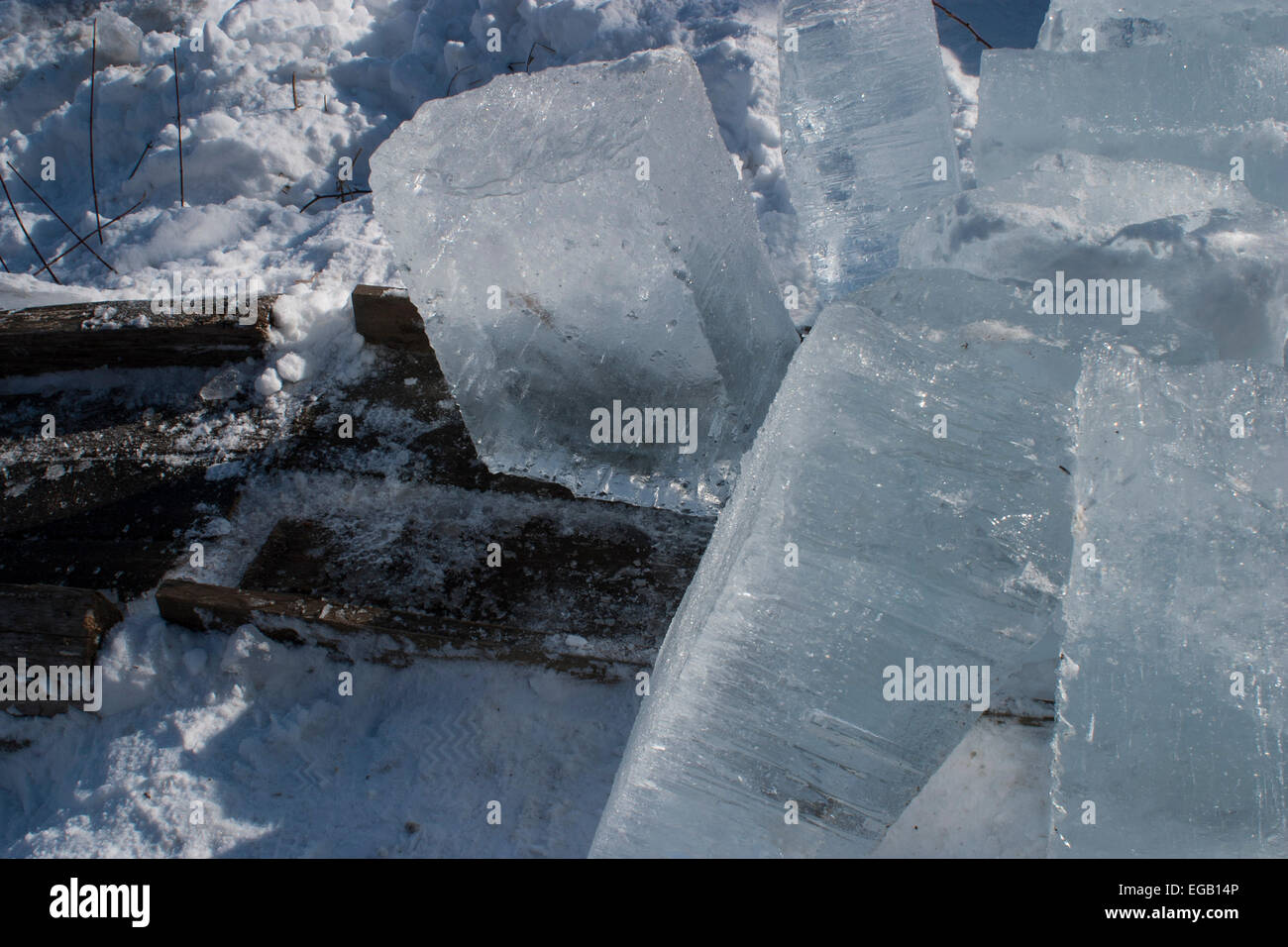 Blocks of ice have been cut by hand saw in a small pond Stock Photo - Alamy