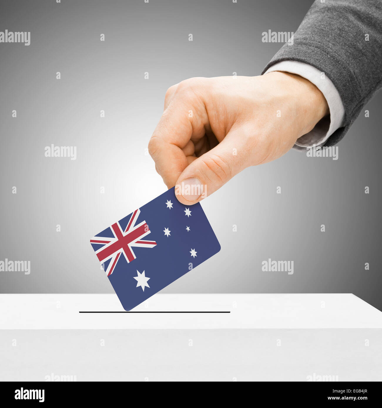 Voting concept - Male inserting flag into ballot box - Australia Stock ...