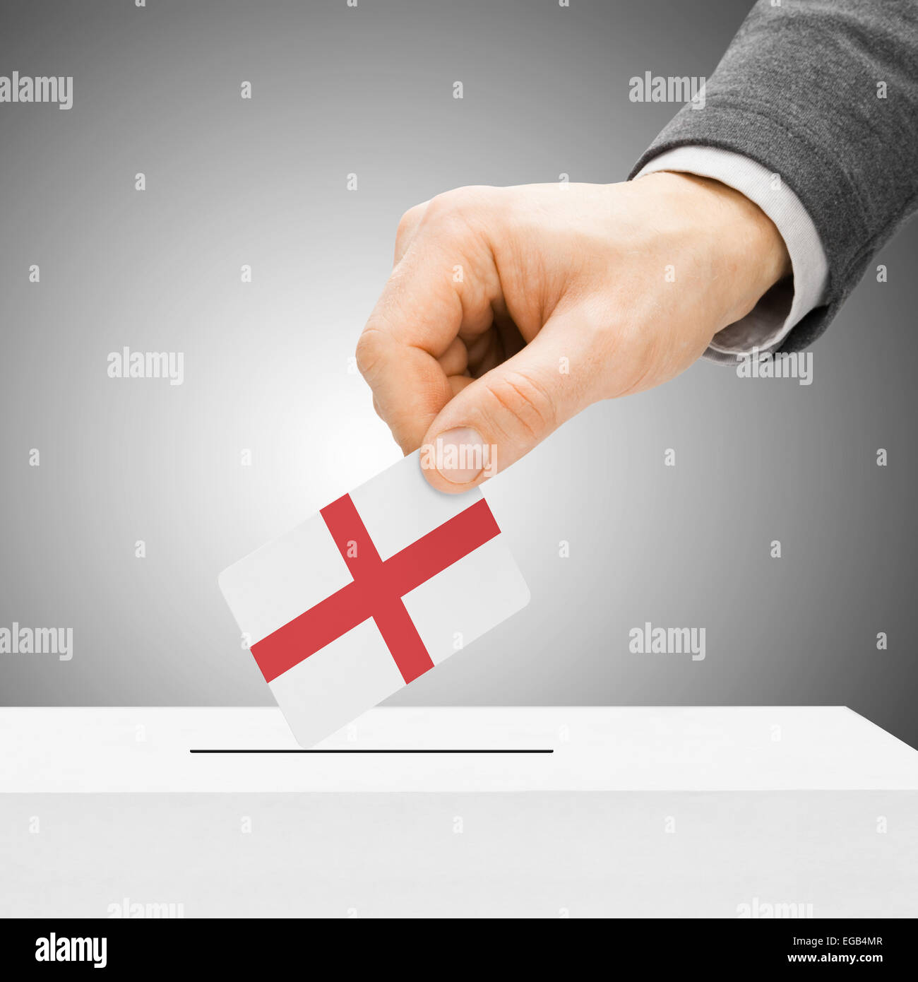 Voting concept - Male inserting flag into ballot box - England Stock ...