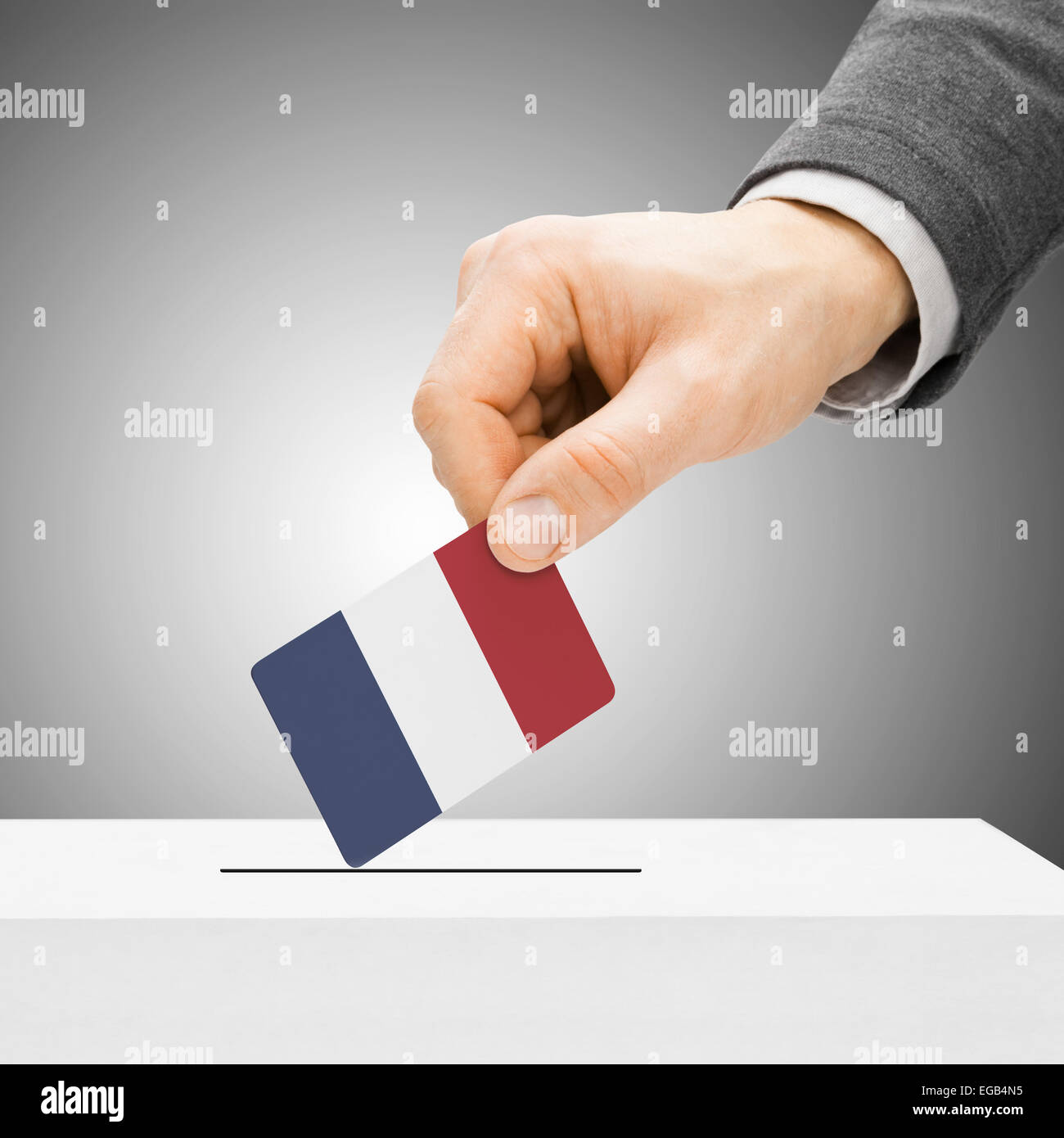 Voting concept - Male inserting flag into ballot box - France Stock ...
