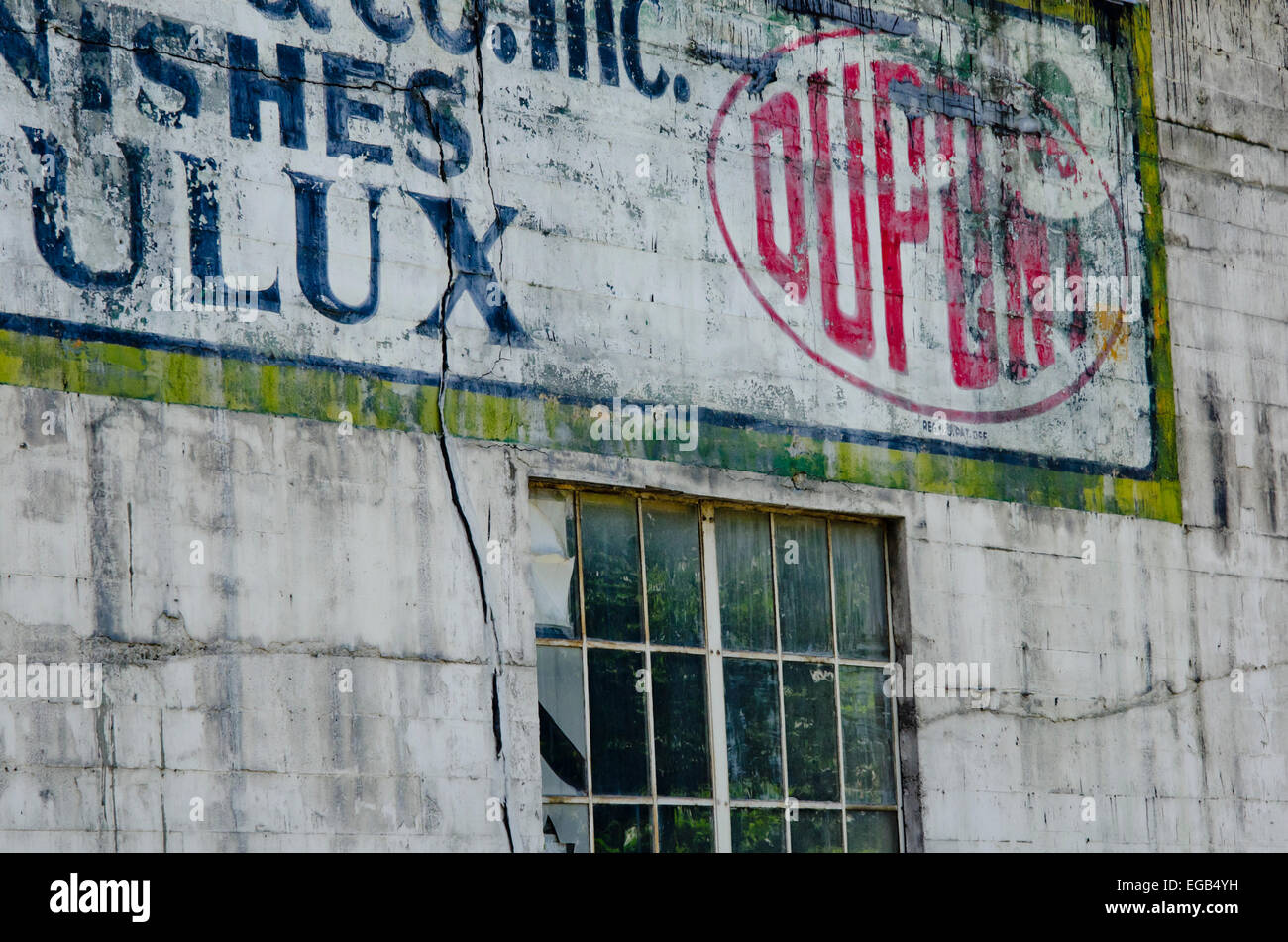 Weathered and peeling paint on the side of a building Stock Photo - Alamy