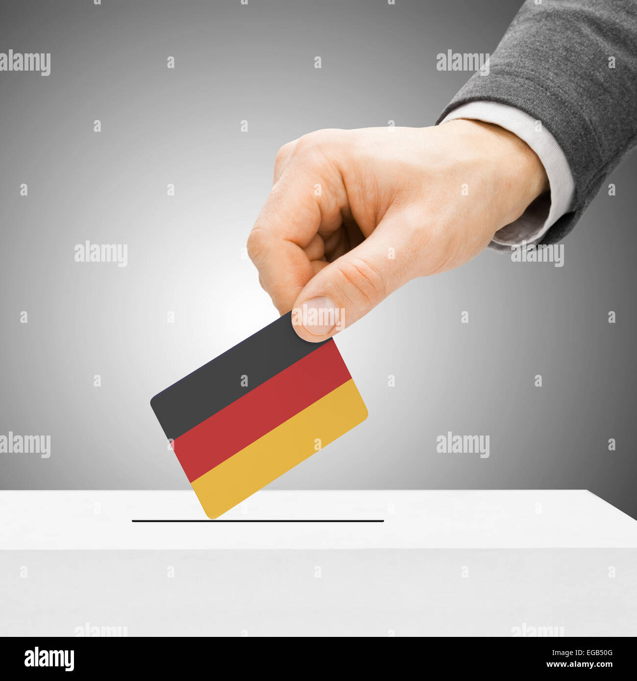Voting concept - Male inserting flag into ballot box - Germany Stock ...