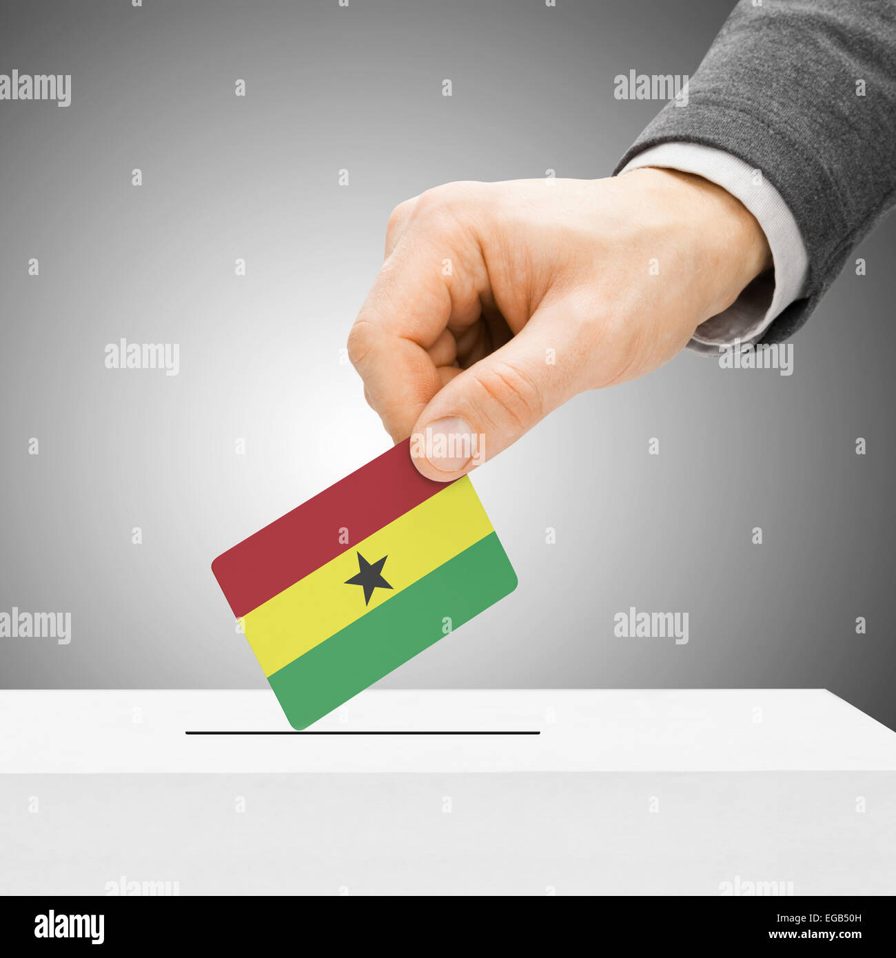 Voting concept - Male inserting flag into ballot box - Ghana Stock ...