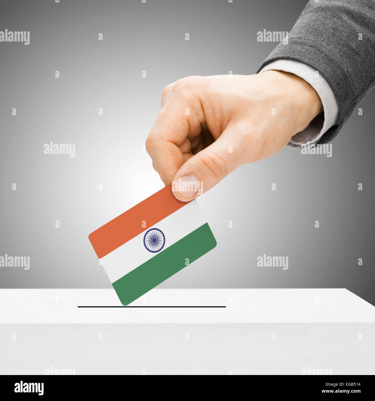 Voting concept - Male inserting flag into ballot box - India Stock ...