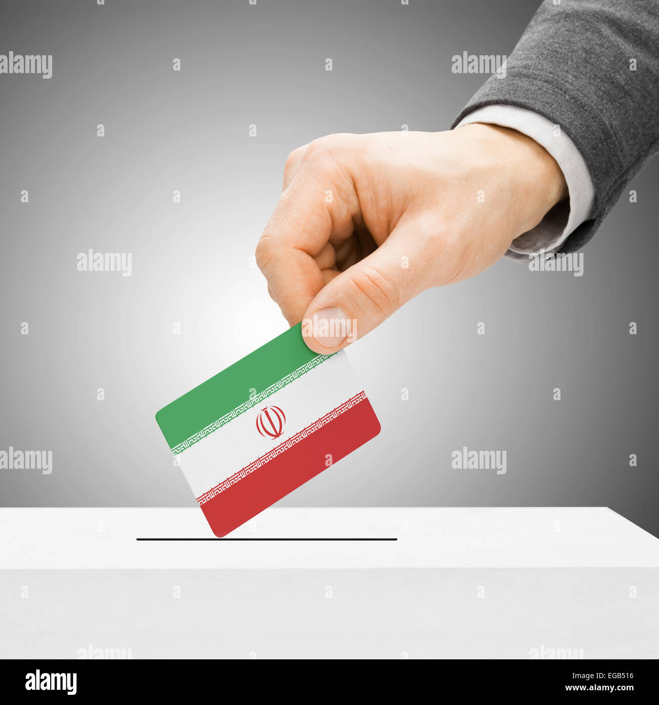 Voting concept - Male inserting flag into ballot box - Iran Stock Photo ...