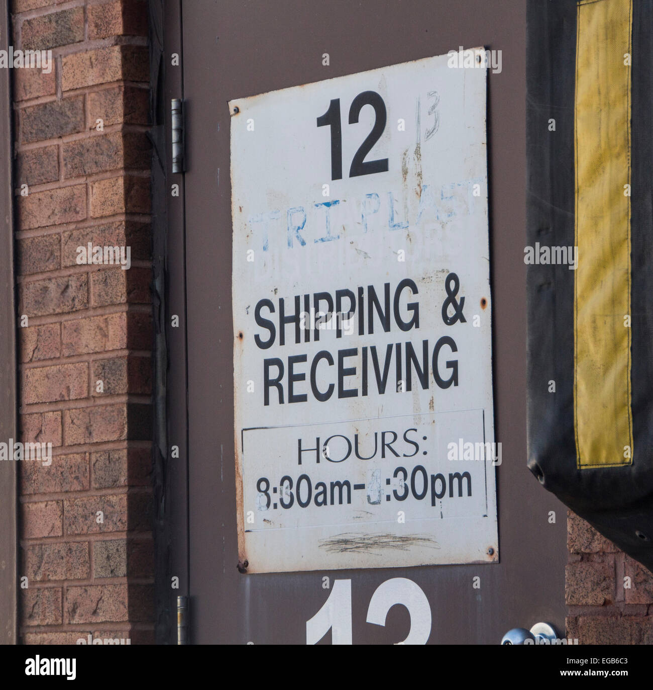 Shipping and Receiving sign on door Stock Photo - Alamy