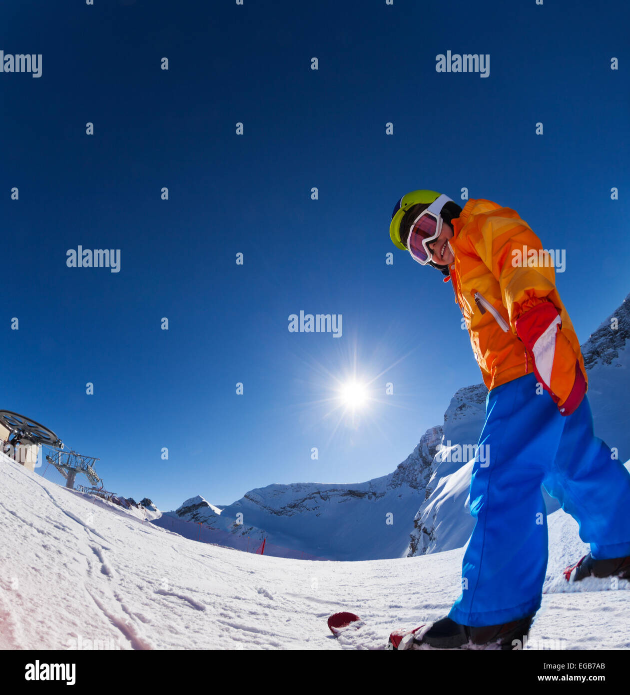 Fisheye view of smiling boy in ski mask skiing Stock Photo - Alamy