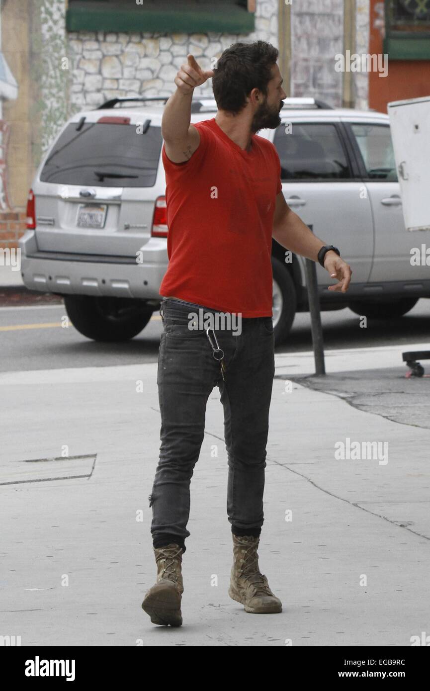 A bearded Shia LaBeouf wearing his favourite old red 'Mighty Alpha ...