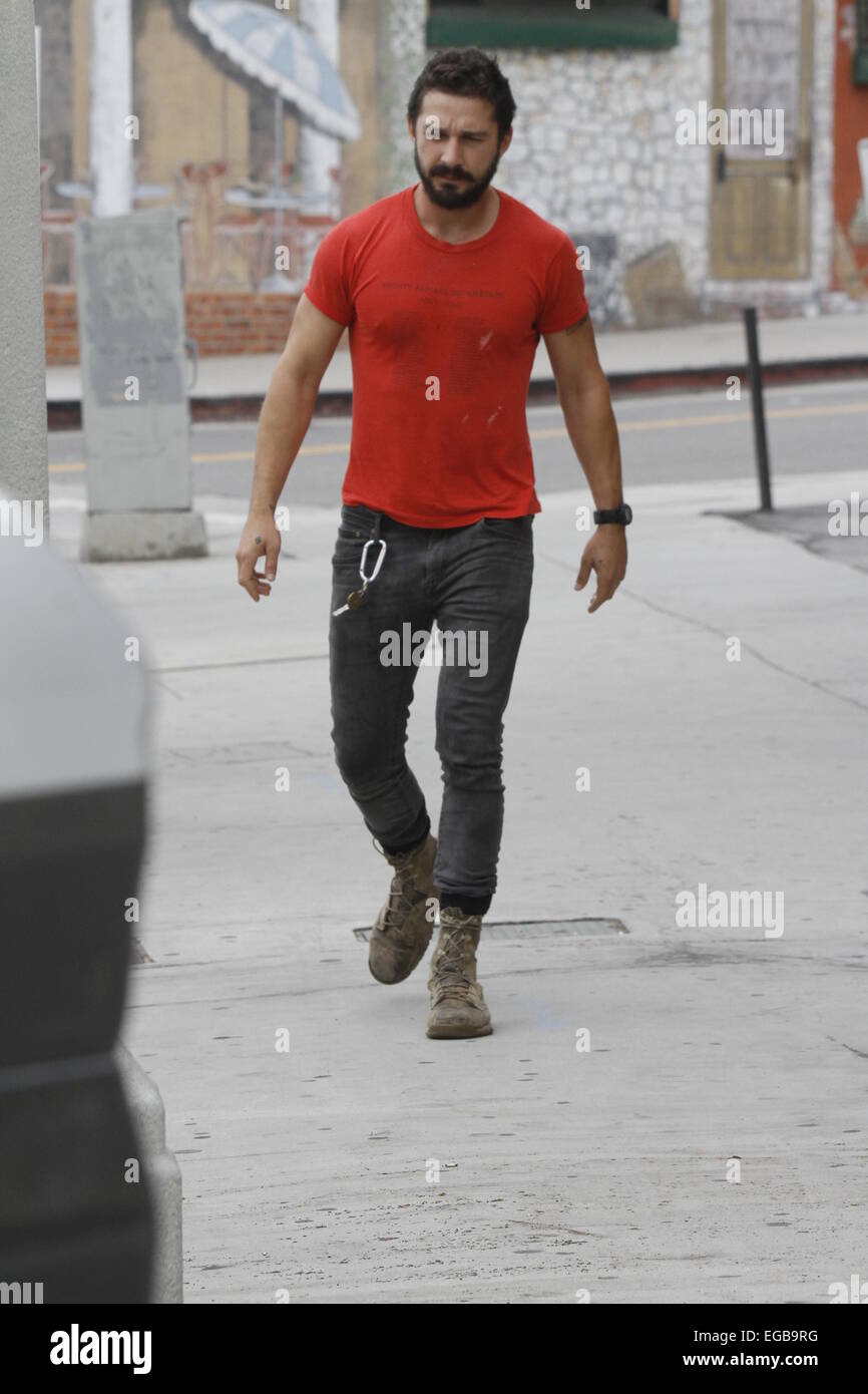 A bearded Shia LaBeouf wearing his favourite old red 'Mighty Alpha ...