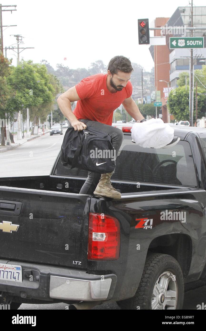 A bearded Shia LaBeouf wearing his favourite old red 'Mighty Alpha ...