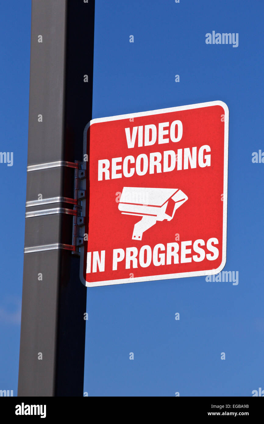 Video recording in progress sign in store parking lot warning people ...