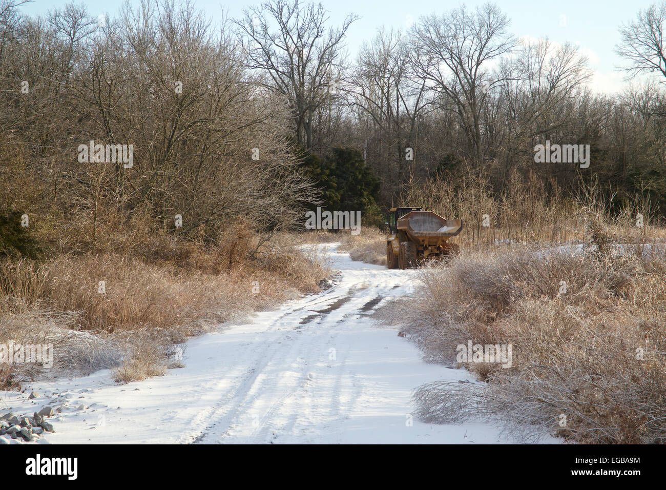 Snowy entrance to a rural road Stock Photo - Alamy