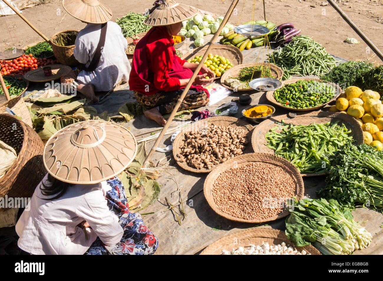 Locals at 5 Day Market, a rotating system,on banks of Inle Lake. Here ...