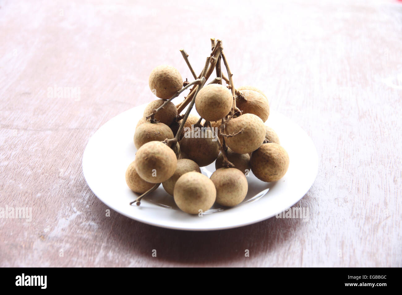 Fresh longan fruit in dish on the foods table Stock Photo - Alamy