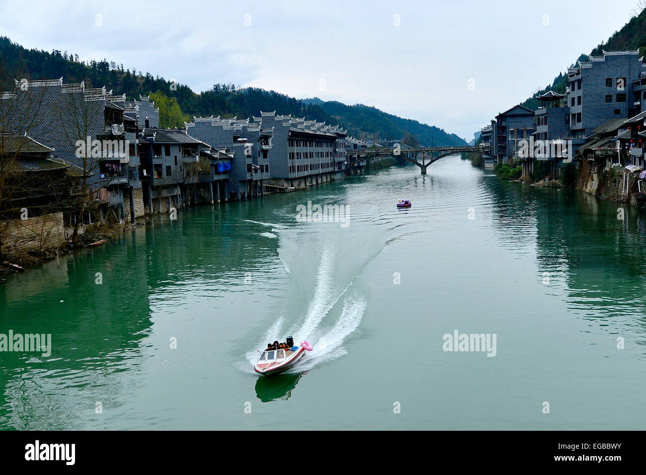 Longshan, China's Hunan Province. 21st Feb, 2015. Tourists take a boat ...