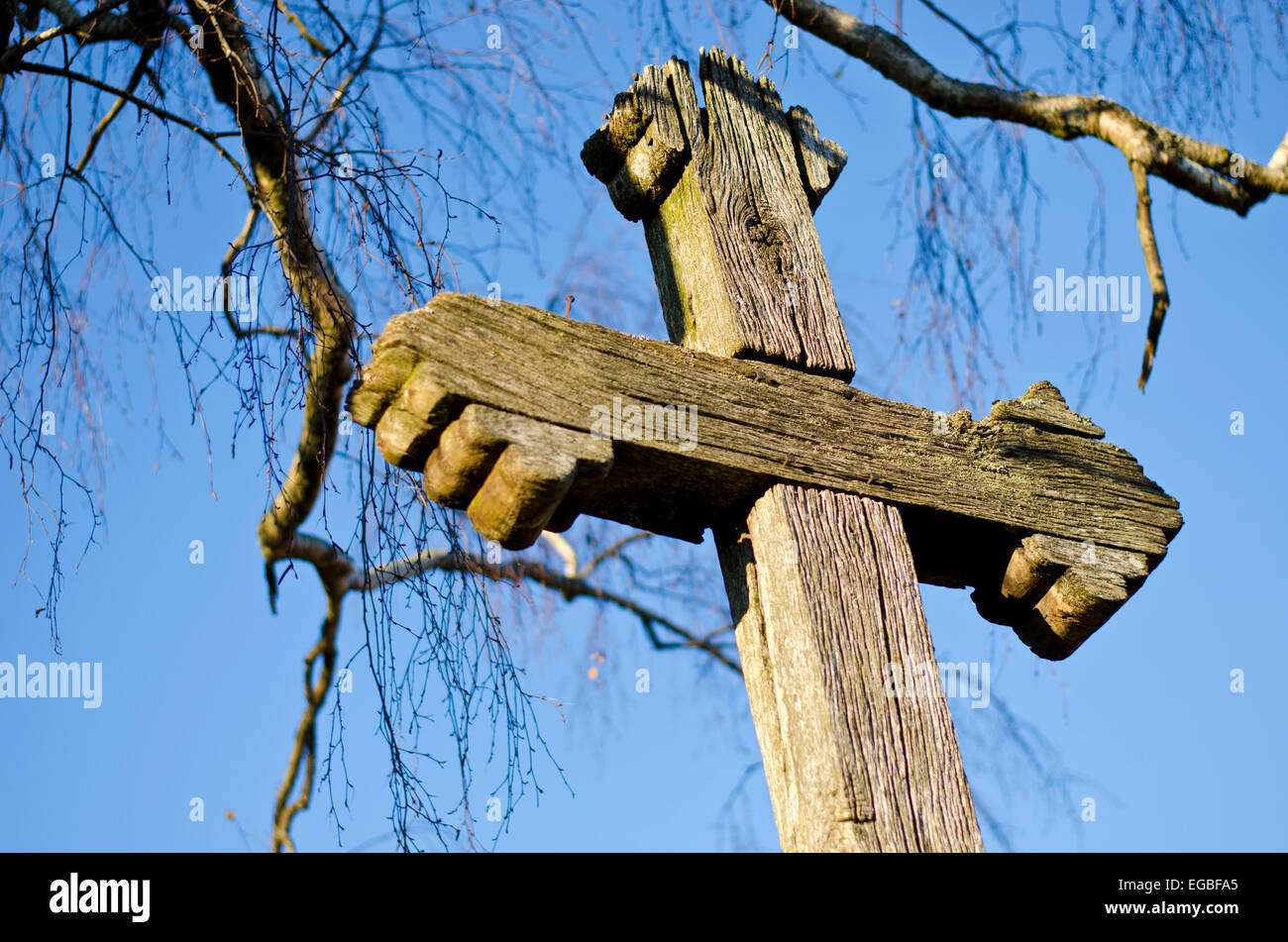 old wooden historical cross fragment on sky background Stock Photo - Alamy