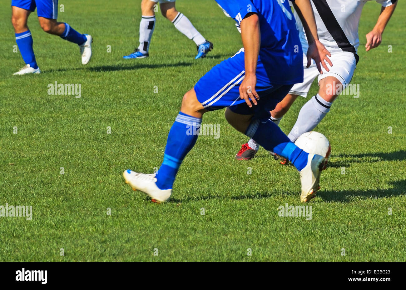 Soccer players in action Stock Photo - Alamy