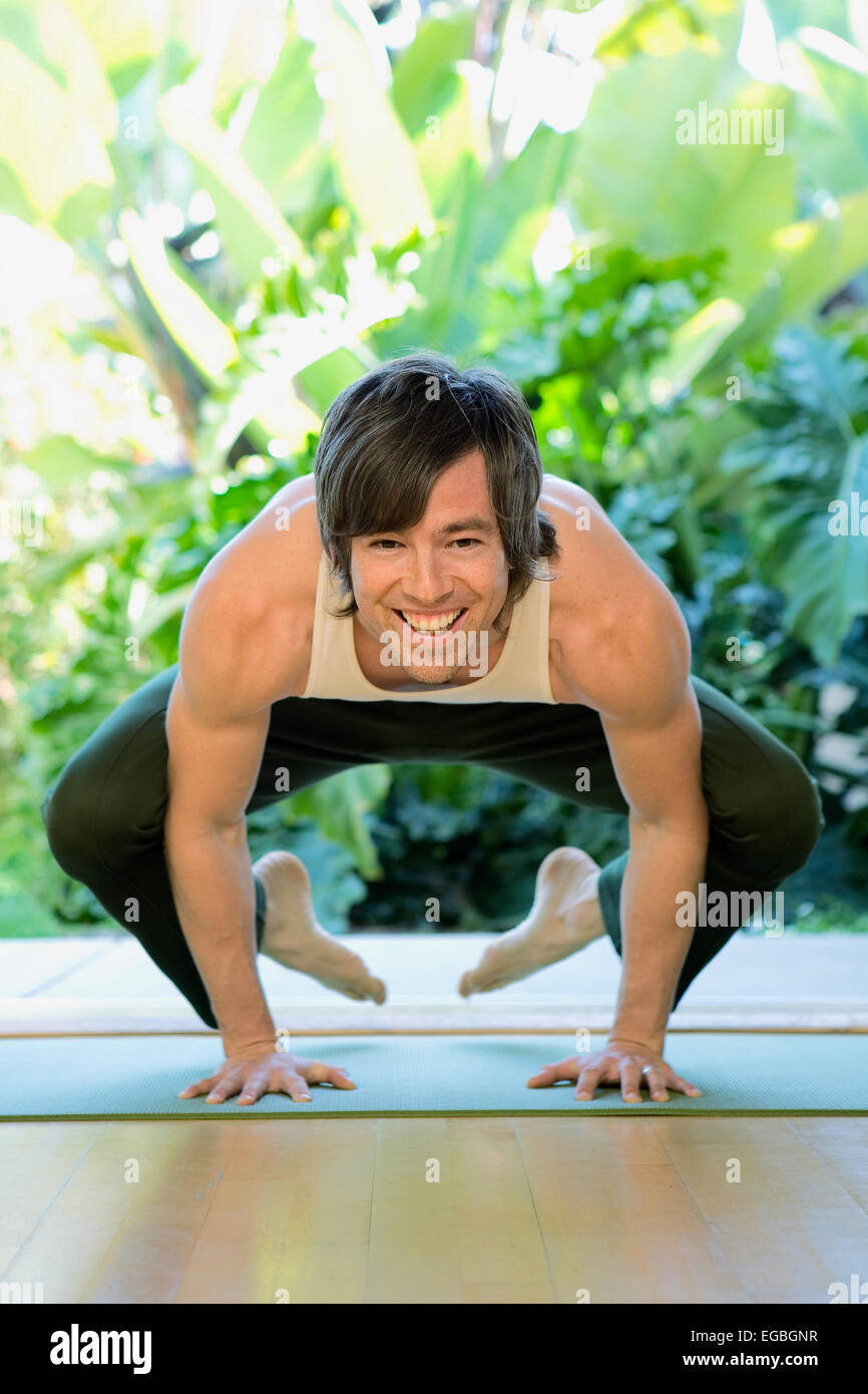 Yoga - crow pose Stock Photo - Alamy