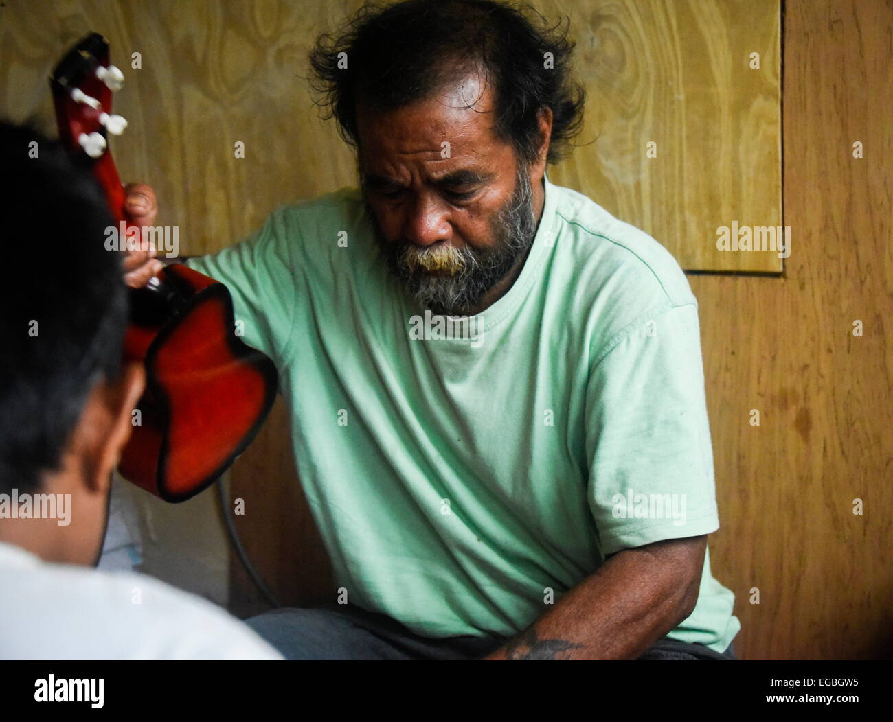 Solevu Village, Malolo Islands, Fiji. 3rd Feb, 2015. A male villager ...