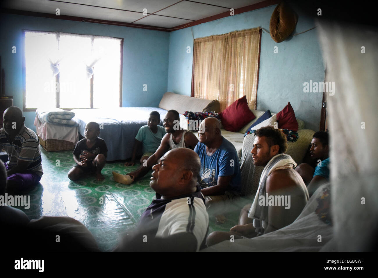 Solevu Village, Malolo Islands, Fiji. 6th Feb, 2015. Villagers sit ...
