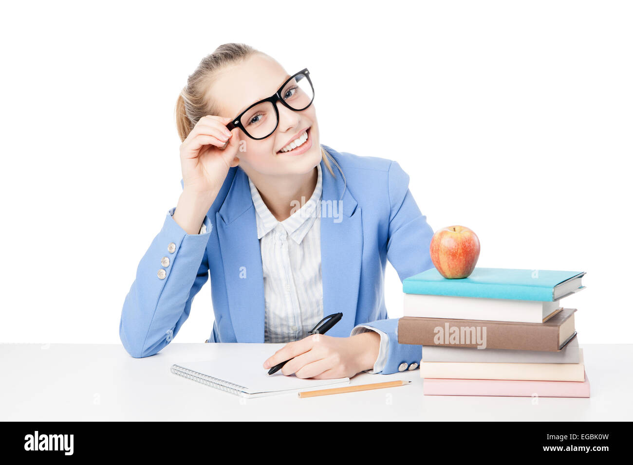 Smiling student with stack of books Stock Photo - Alamy
