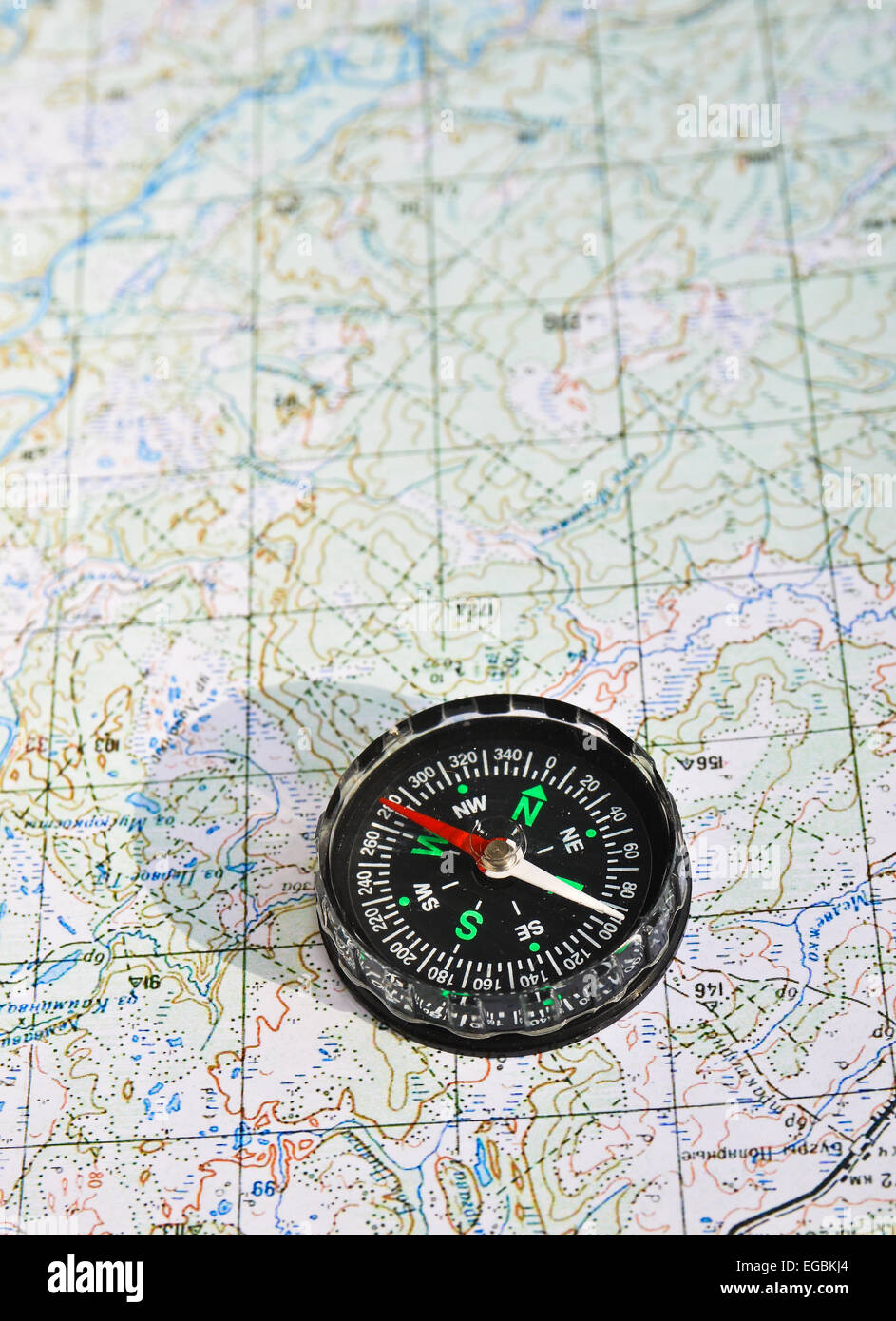 The magnetic compass and topographic map. Travel compass and map ...