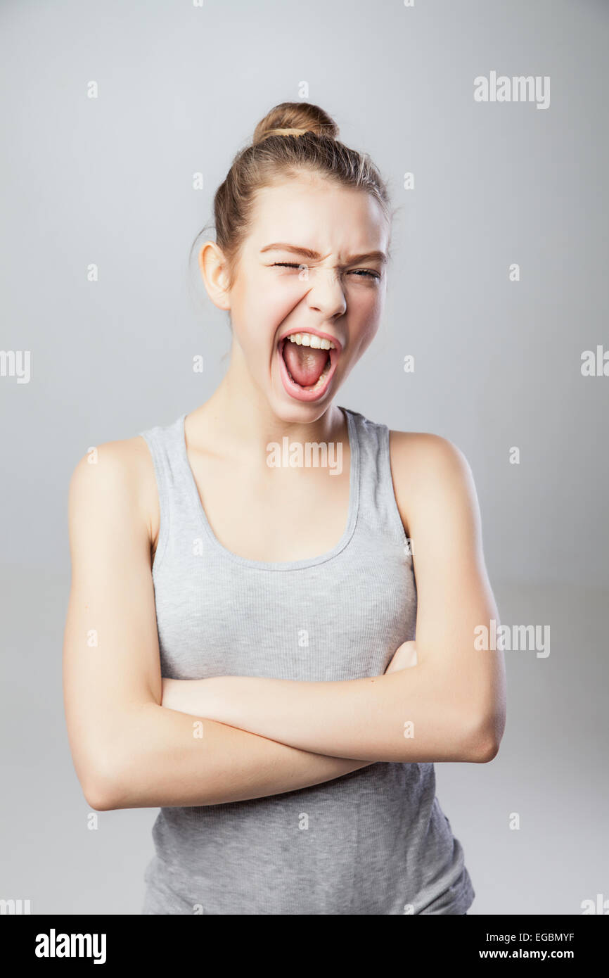 Portrait of a beautiful young woman winking Stock Photo - Alamy