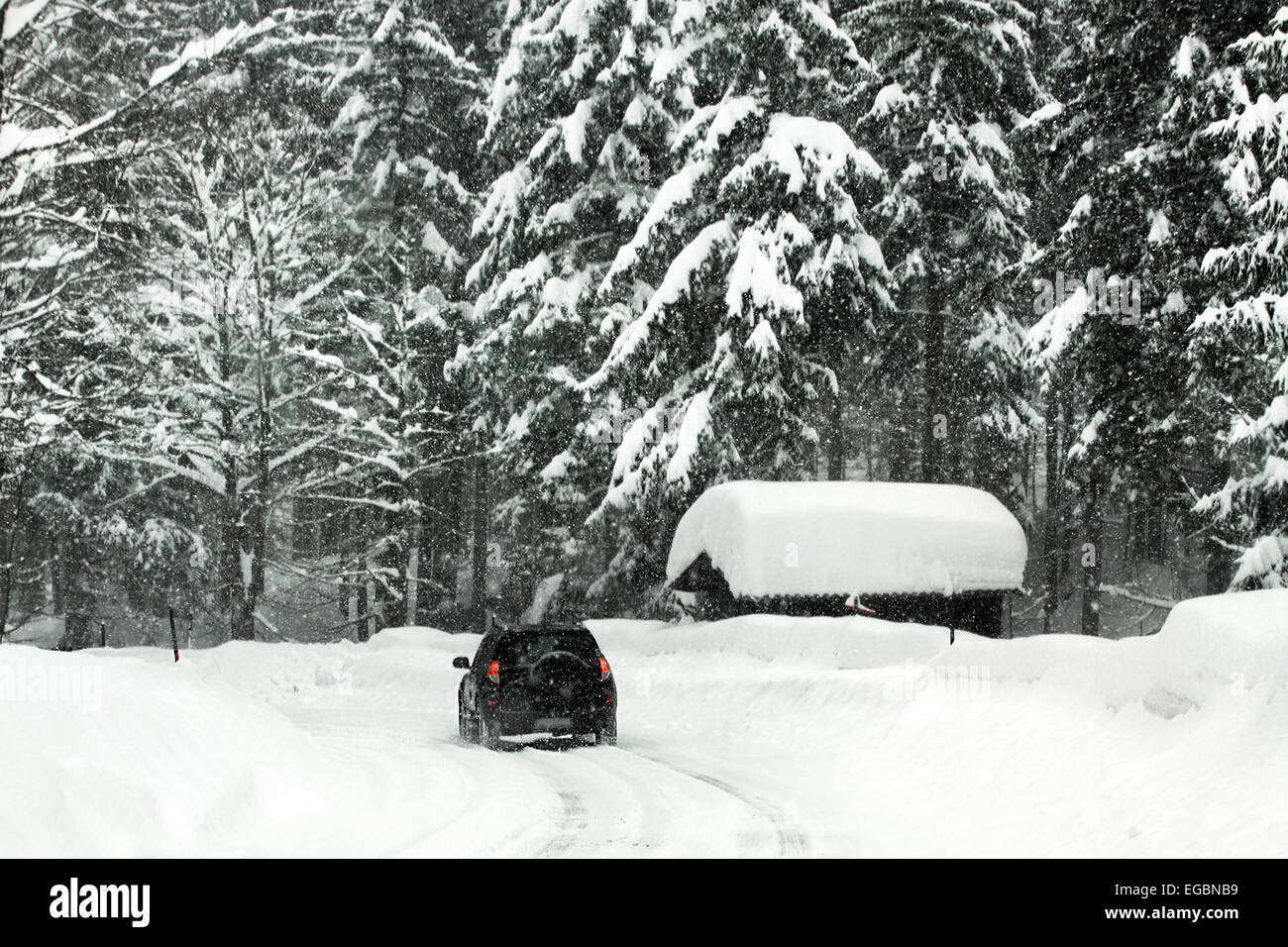 Heavy snow on the Ploecken Pass route of the Austrian Alps. The road is ...