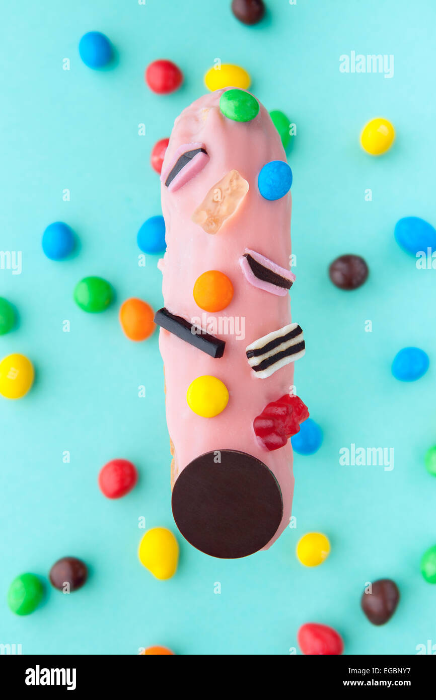 exquisite cream dessert eclair sprinkled with candy Stock Photo - Alamy