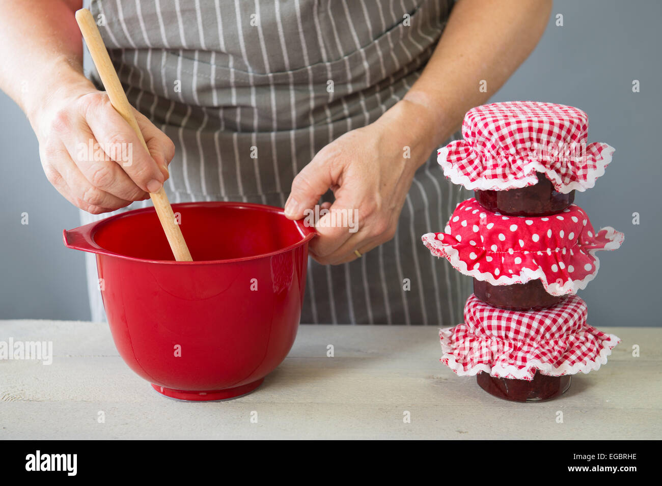 Woman preparing fruit jam Stock Photo - Alamy