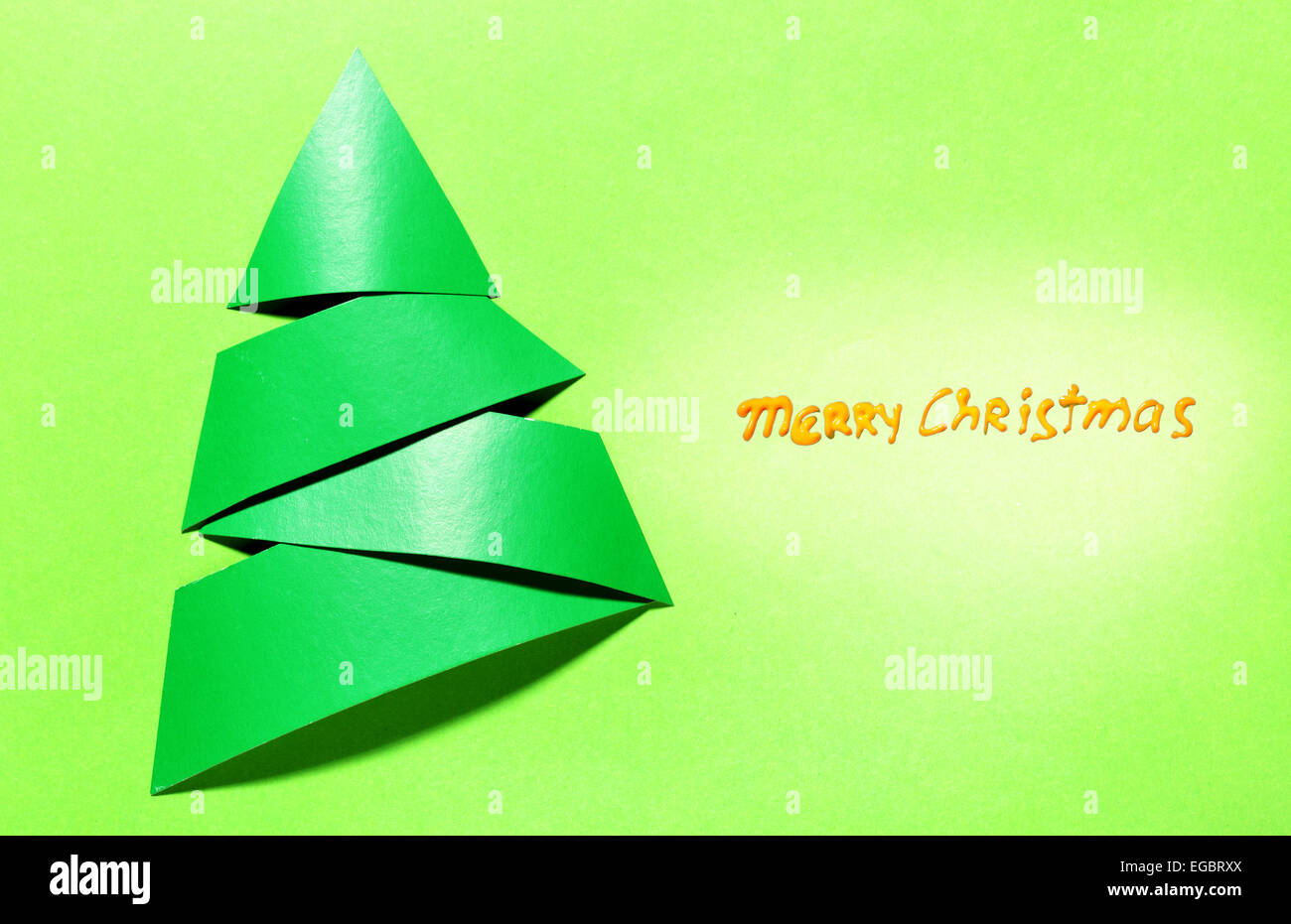 Green paper Christmas tree and wishes Stock Photo - Alamy