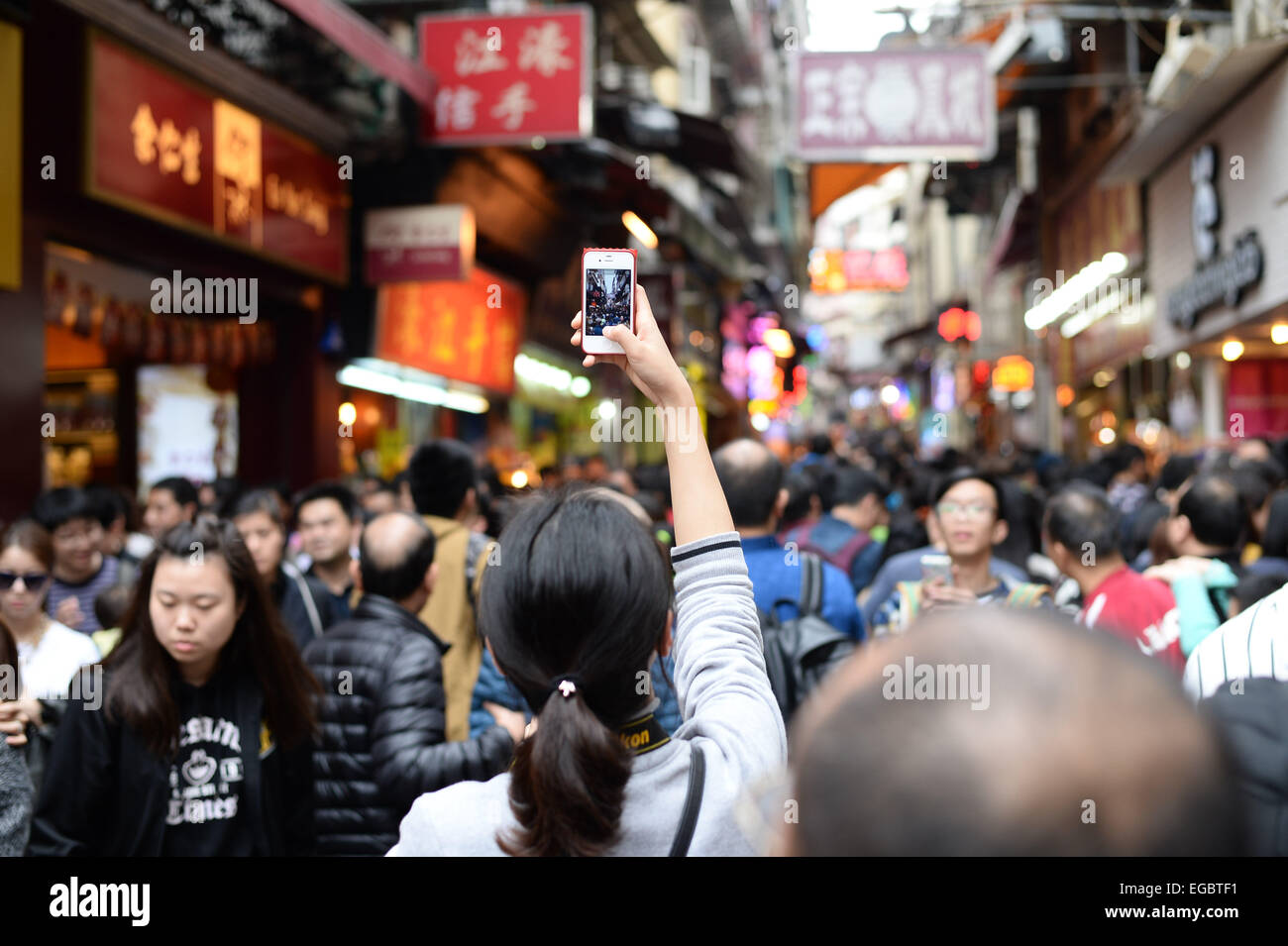 Macao, China. 22nd Feb, 2015. A tourist takes photos during the Spring ...