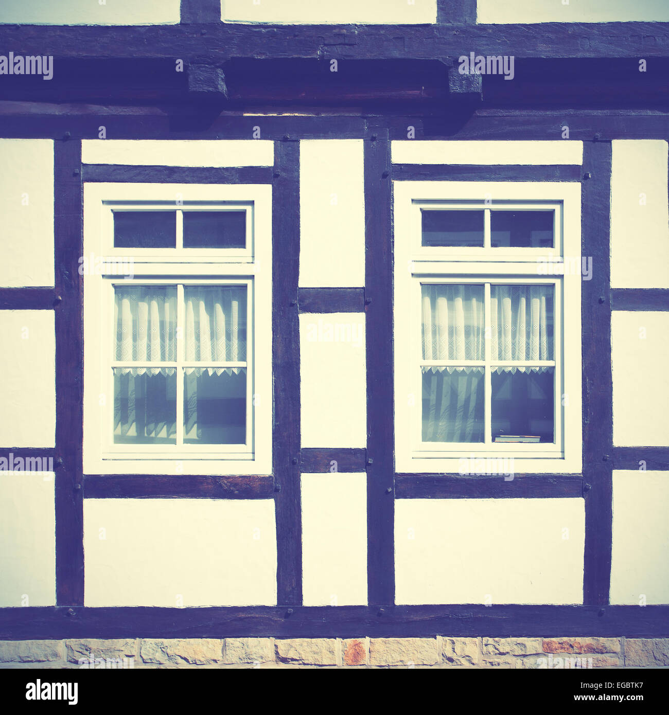 Windows of old timber framing house, Germany. Retro style filtred Stock ...