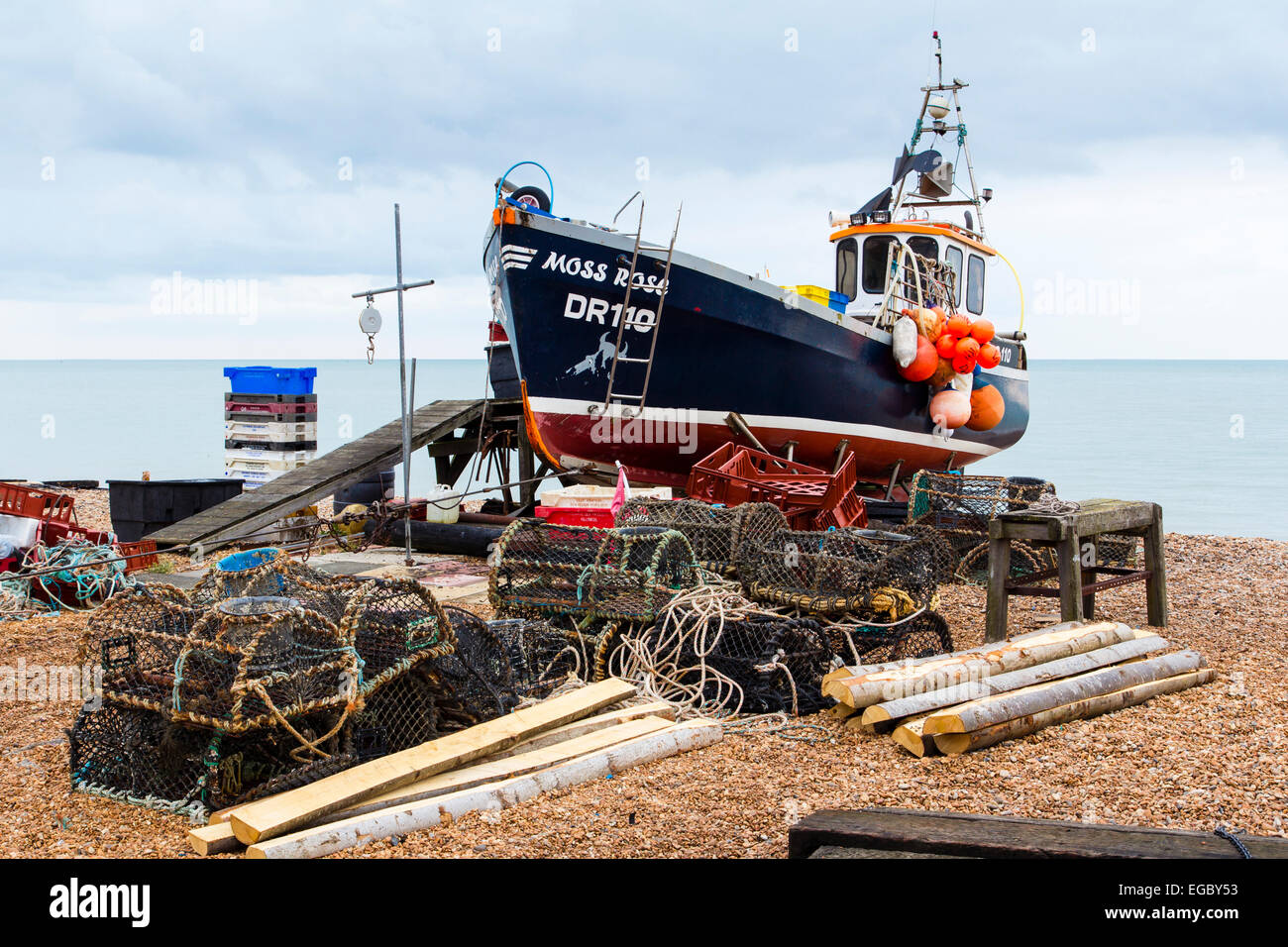 Moss Ross typical fishing boat beached on with lobster pots and nets on ...