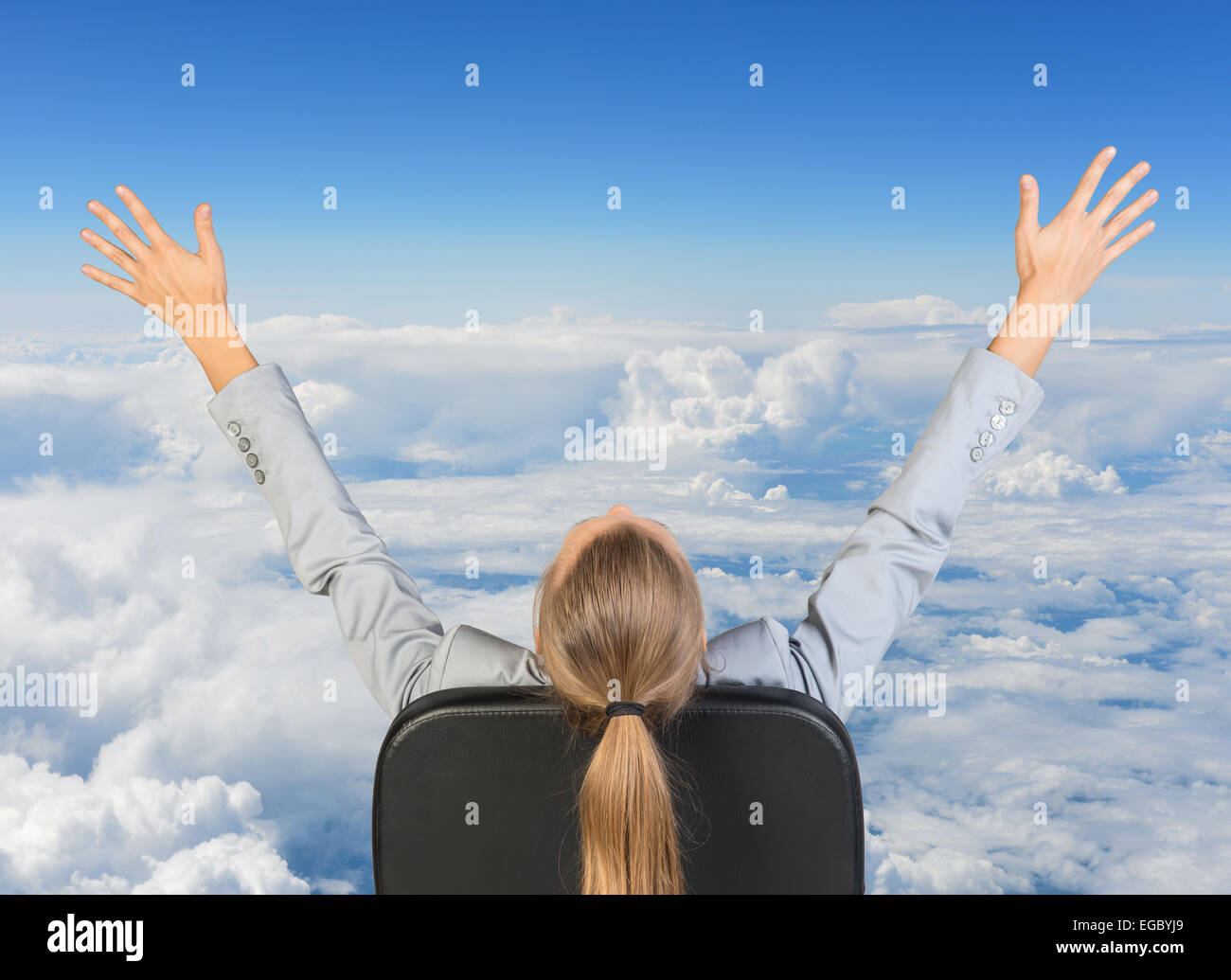 Businesswoman sitting on office chair with her hands outstretched Stock ...