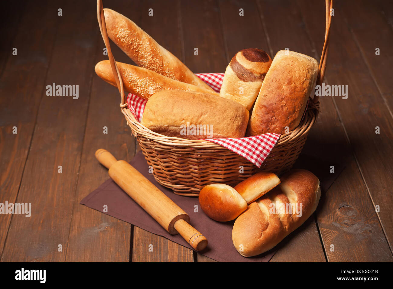 Arrangement of bread in basket and rolling pin Stock Photo - Alamy
