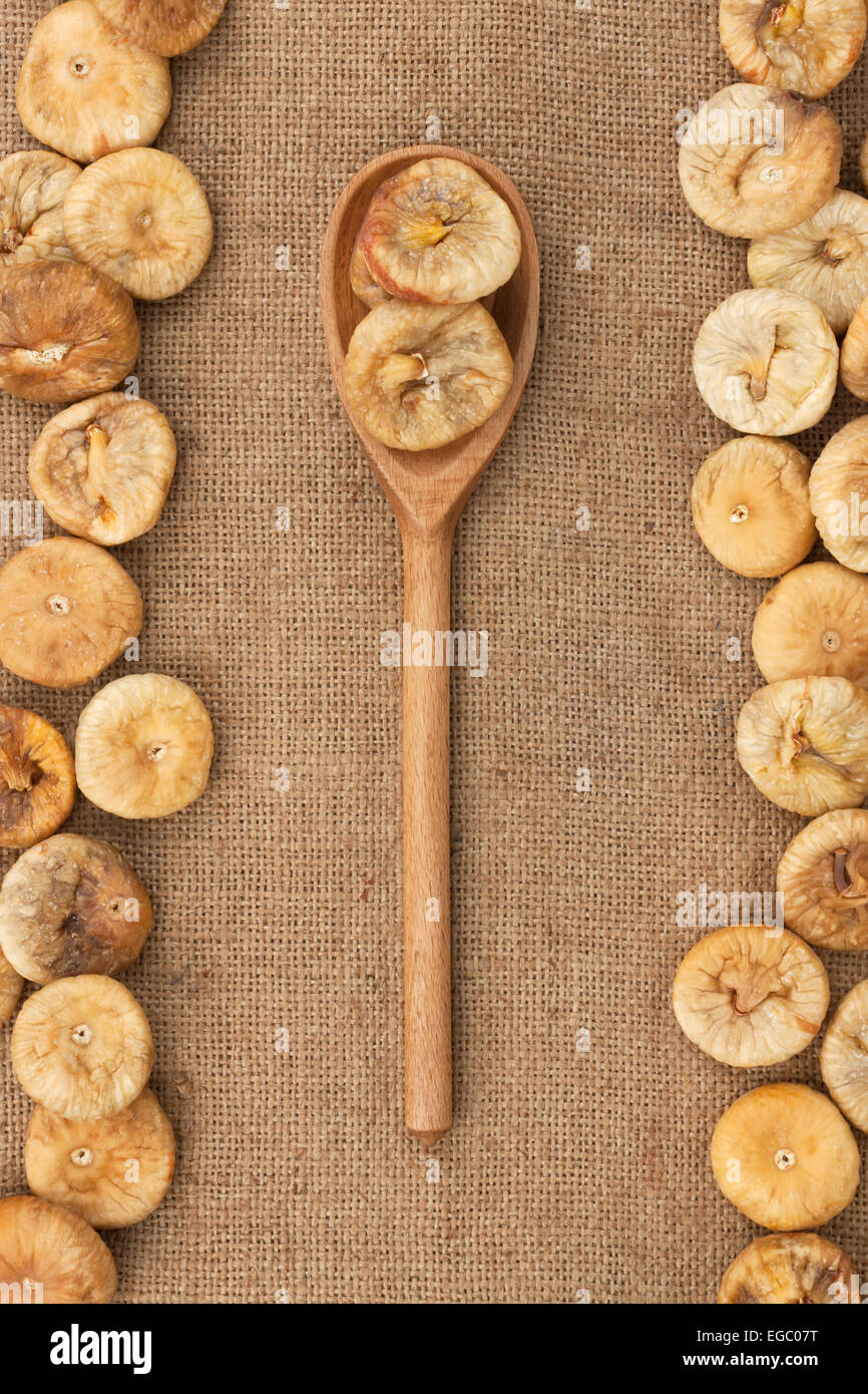Wooden spoon with figs lying on sackcloth Stock Photo - Alamy