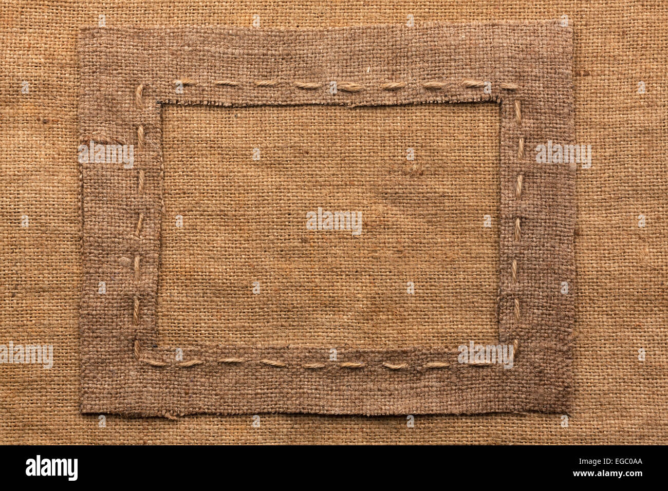 Frame of burlap, lies on a background of burlap,can be used as texture ...