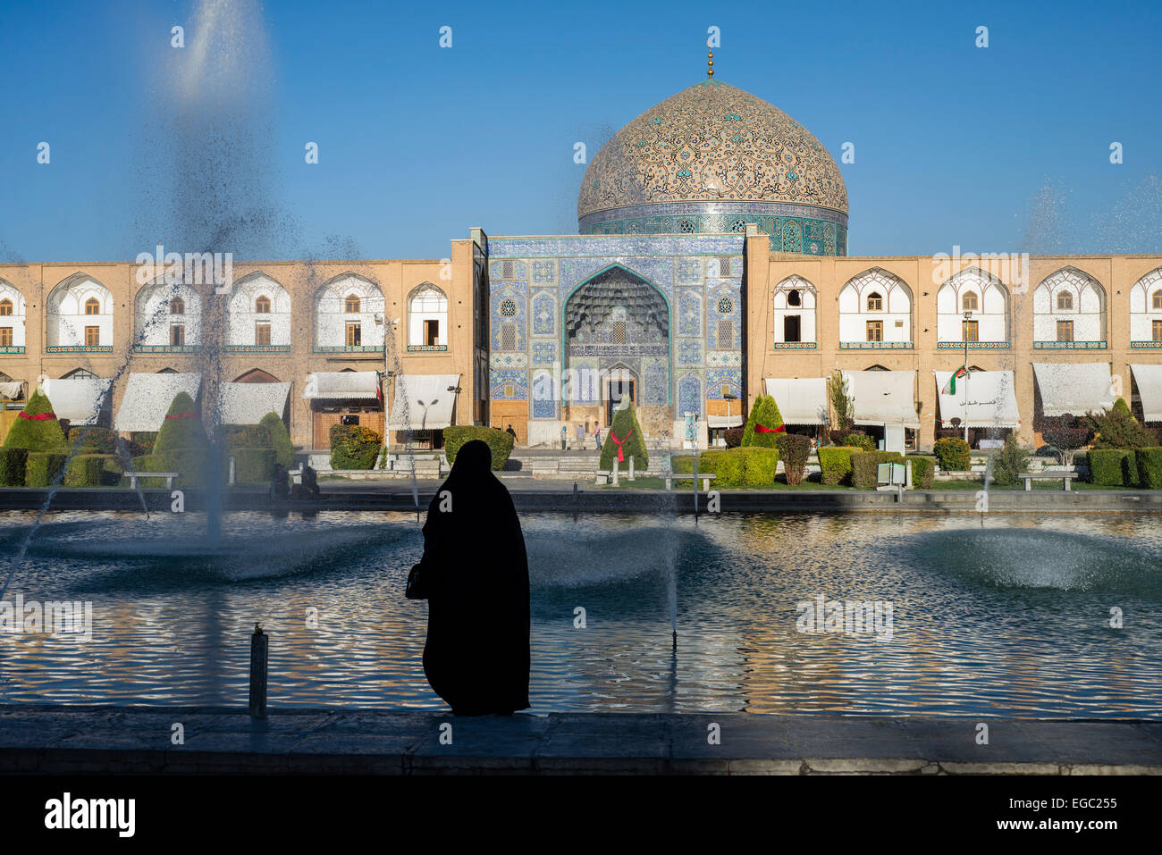 Muslim woman standing in front of the mosque at the Naqsh-e Jahan ...