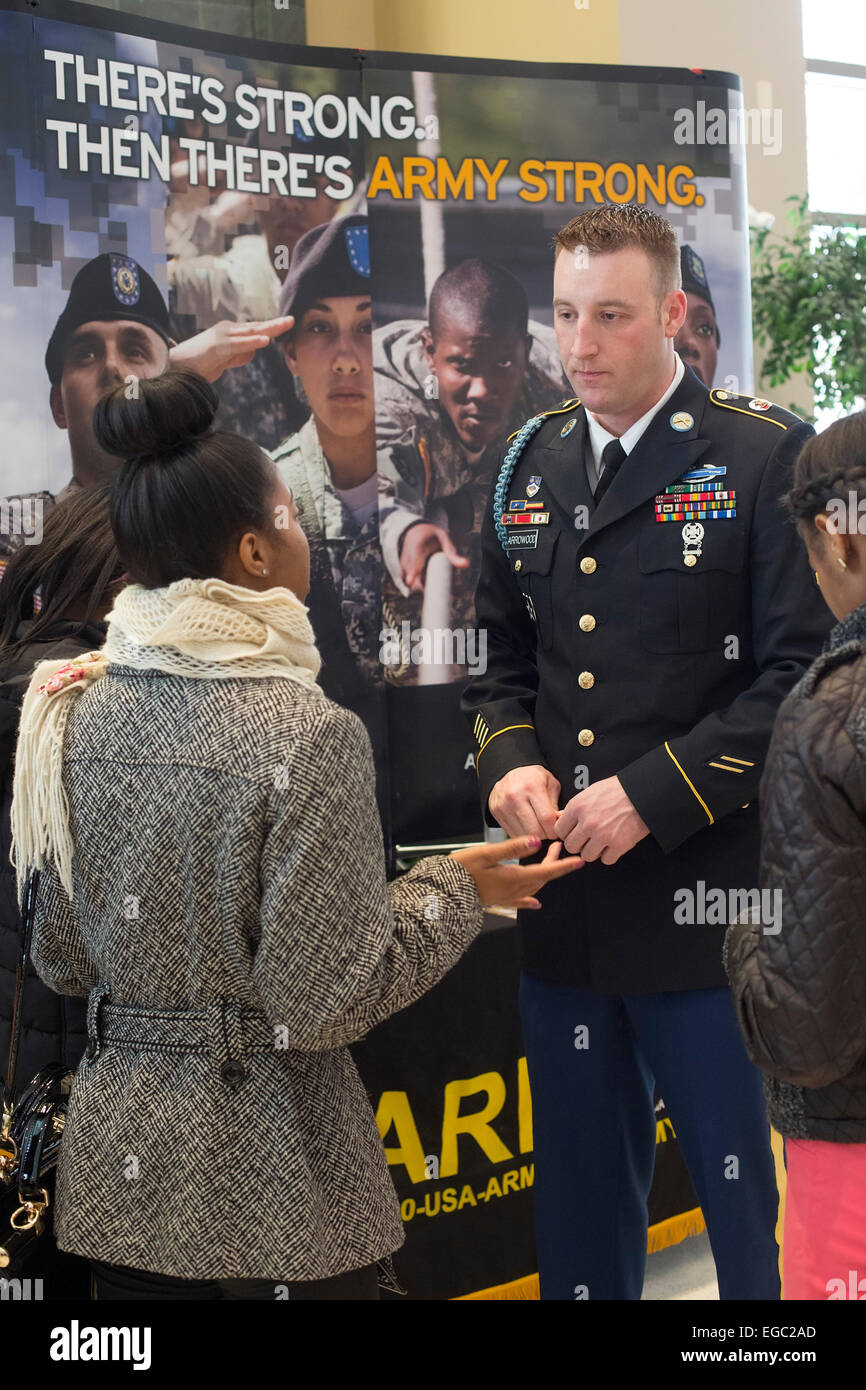 Detroit, Michigan - A U.S. Army recruiter talks to high school students at a college fair at ...