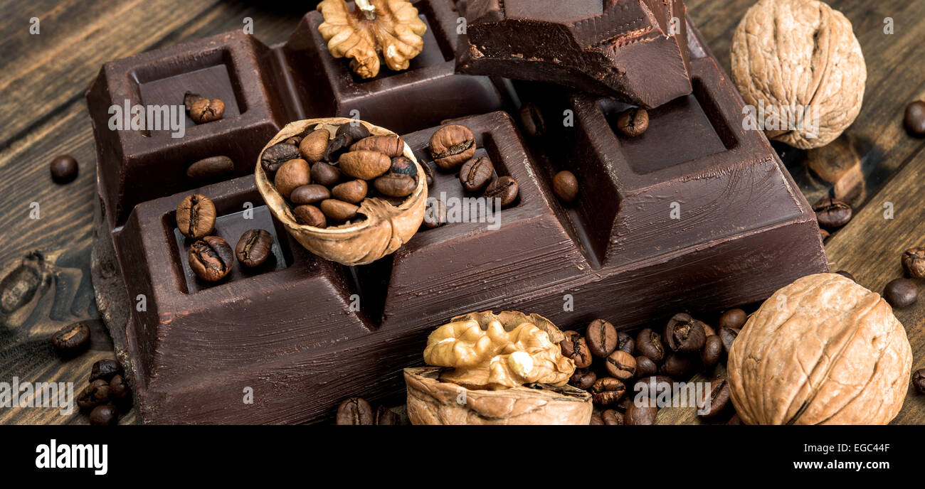 chocolate and walnuts on old wood background Stock Photo - Alamy