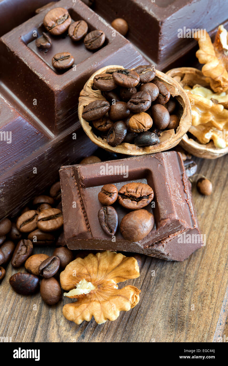chocolate and walnuts on old wood background Stock Photo - Alamy