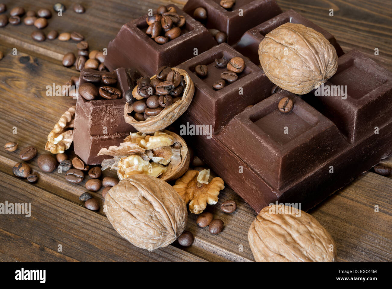 chocolate and walnuts on old wood background Stock Photo - Alamy