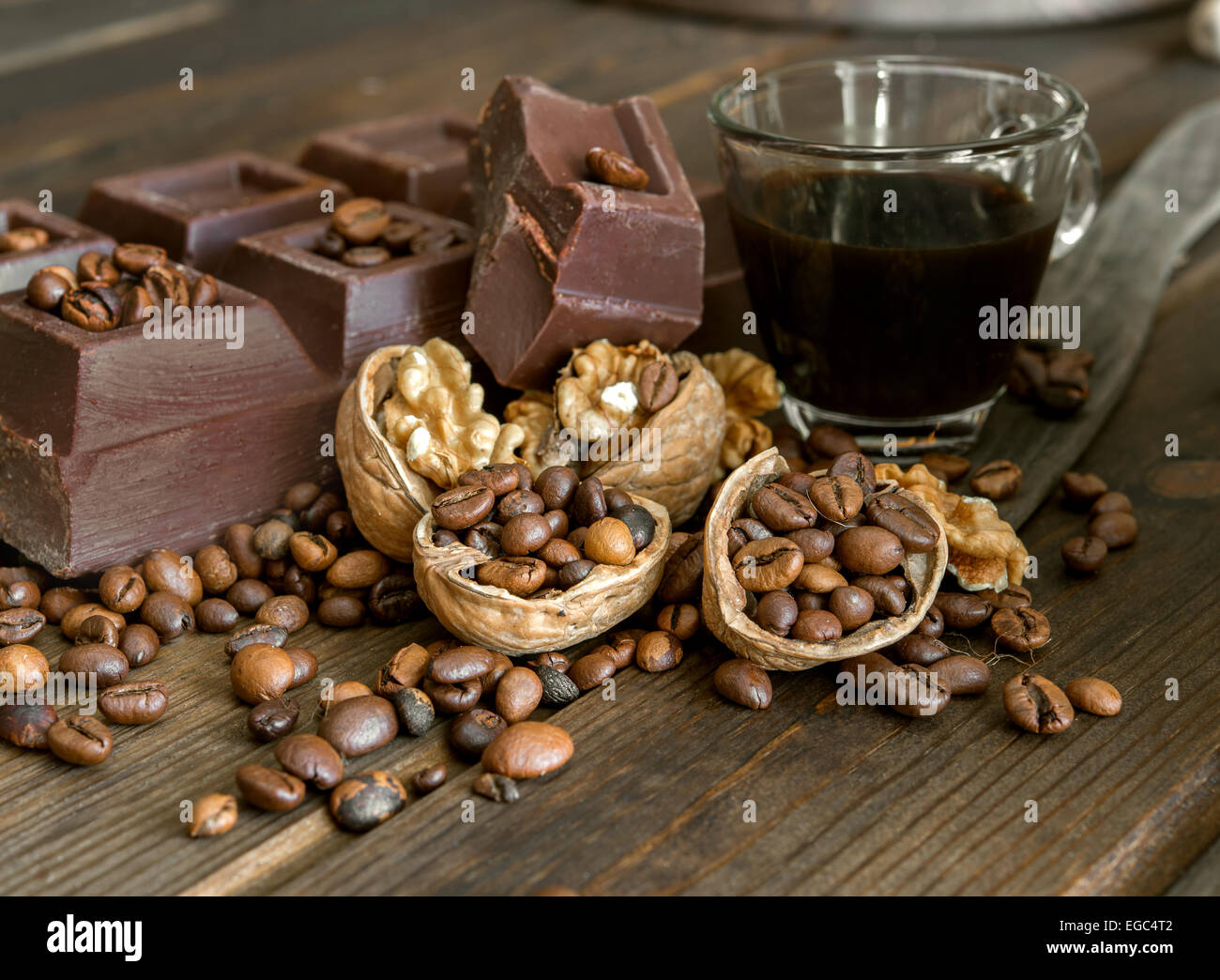 chocolate and walnuts on old wood background Stock Photo - Alamy