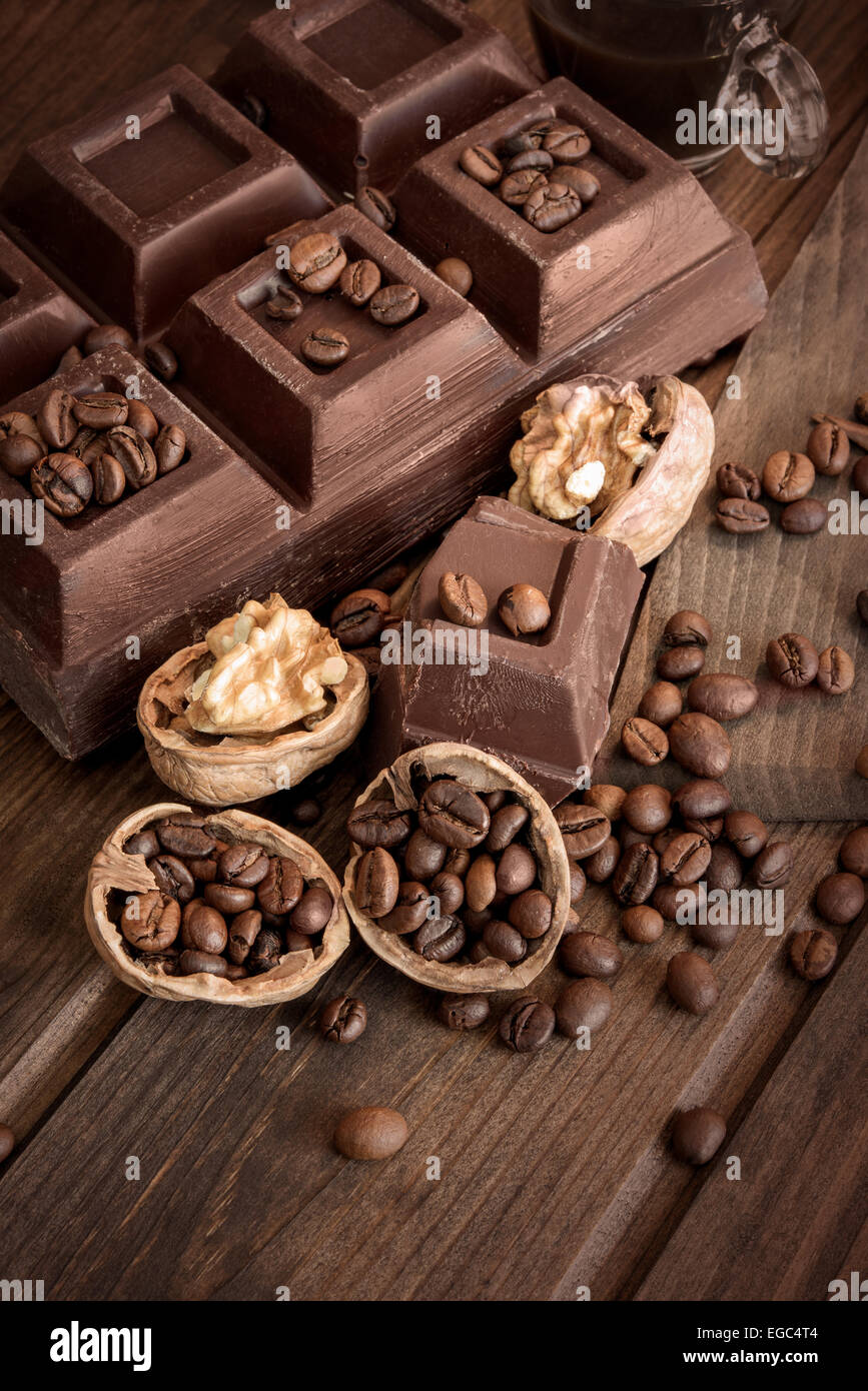 chocolate and walnuts on old wood background Stock Photo - Alamy